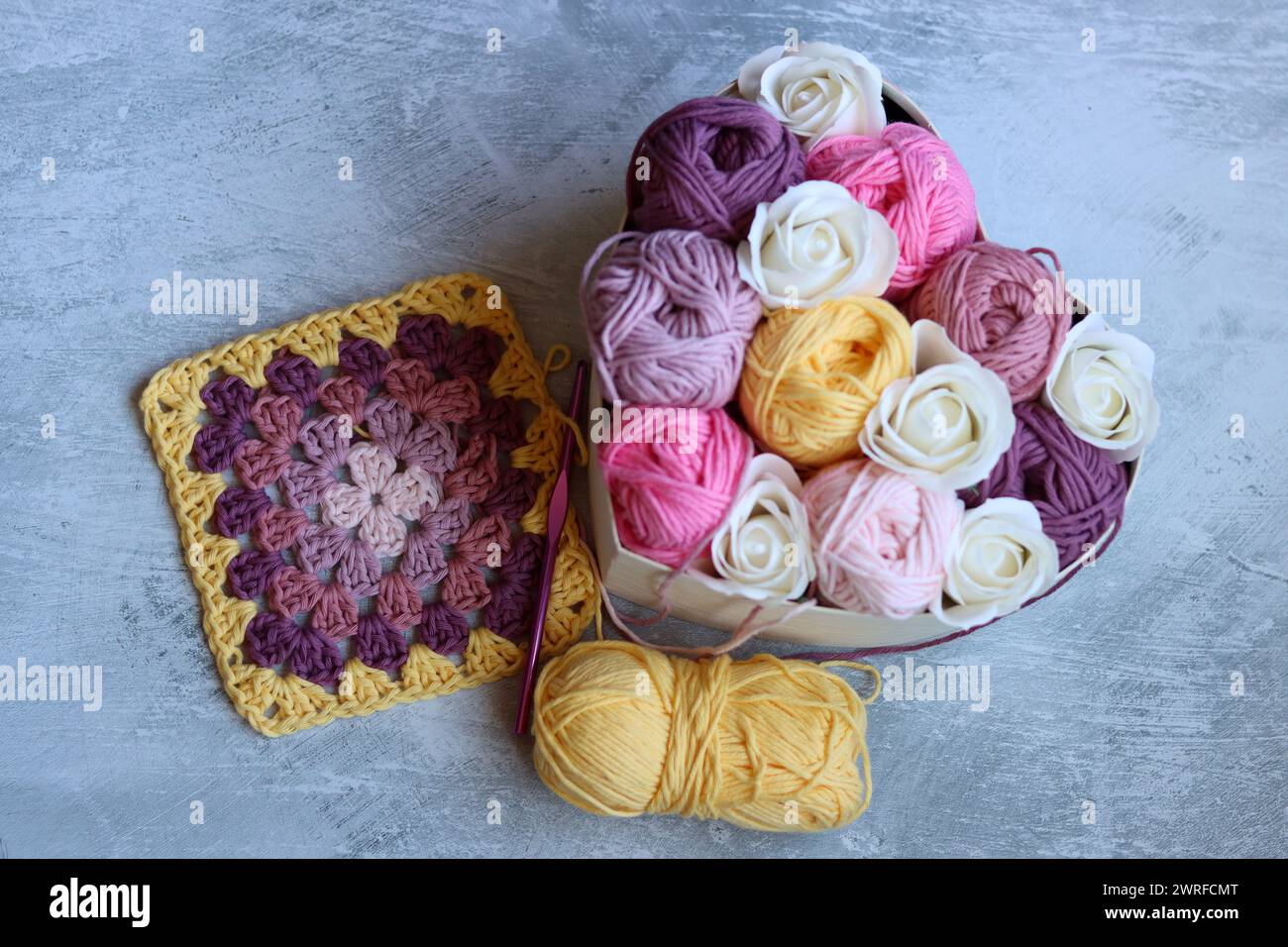 Granny square pattern made of soft organic cotton top view photo. Grey ...