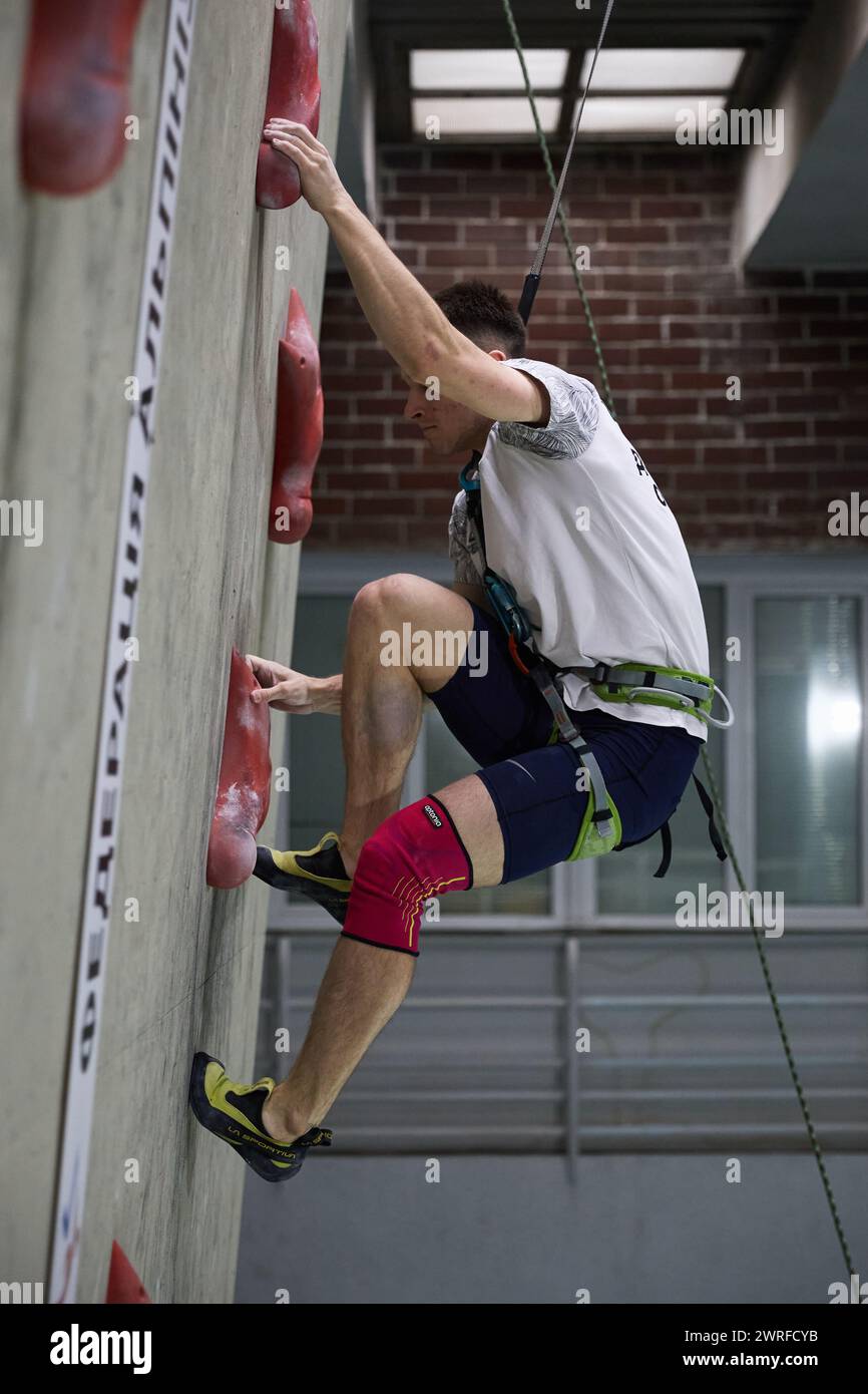 Speed climber climbing the vertical wall at a competition in Kyiv - 6 ...