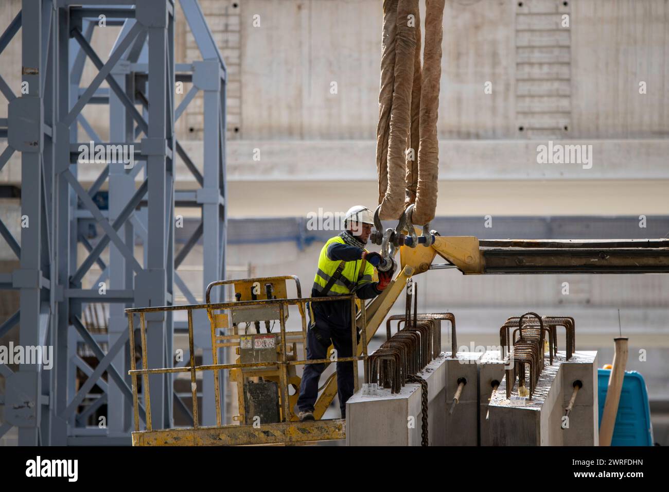 Workers work on the new phase of the central roof structure at La ...