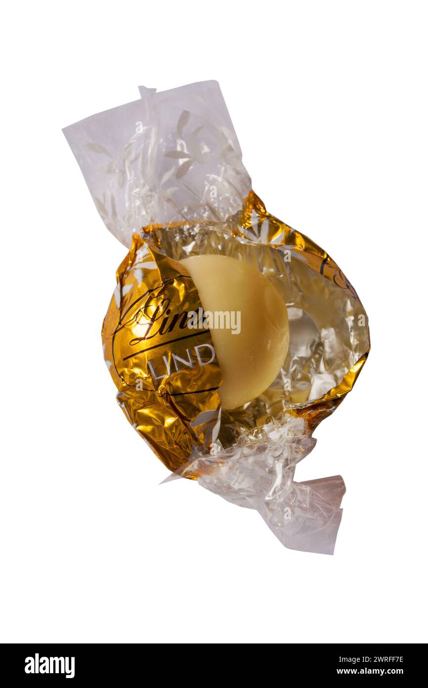 Lindt Lindor white chocolate opened to show contents isolated on white ...