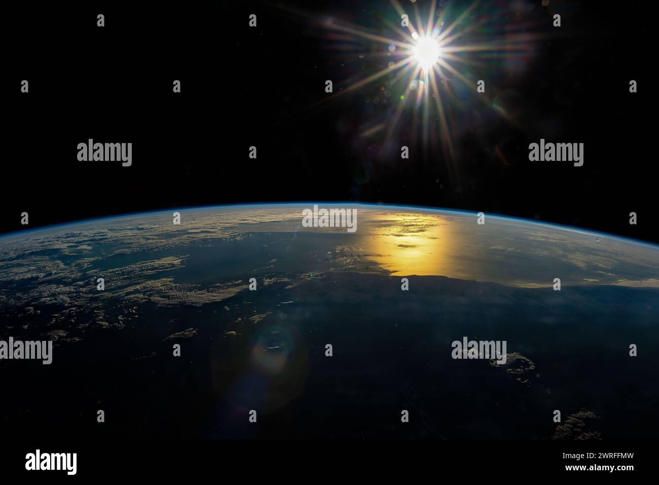 Sun and sunlight reflect in the ocean. Digital enhancement of an image ...