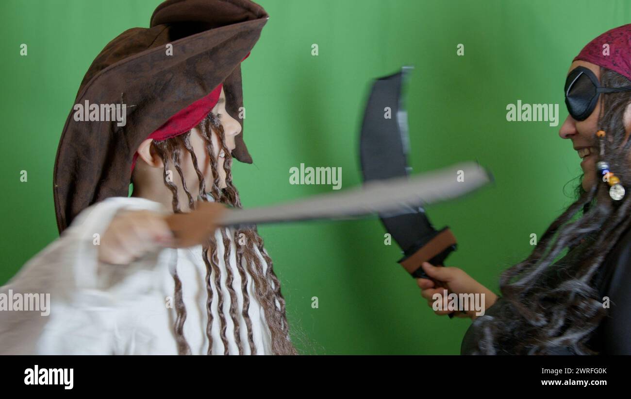 Pirate game. Mom and son having fight with fake cutlasses. Halloween ...