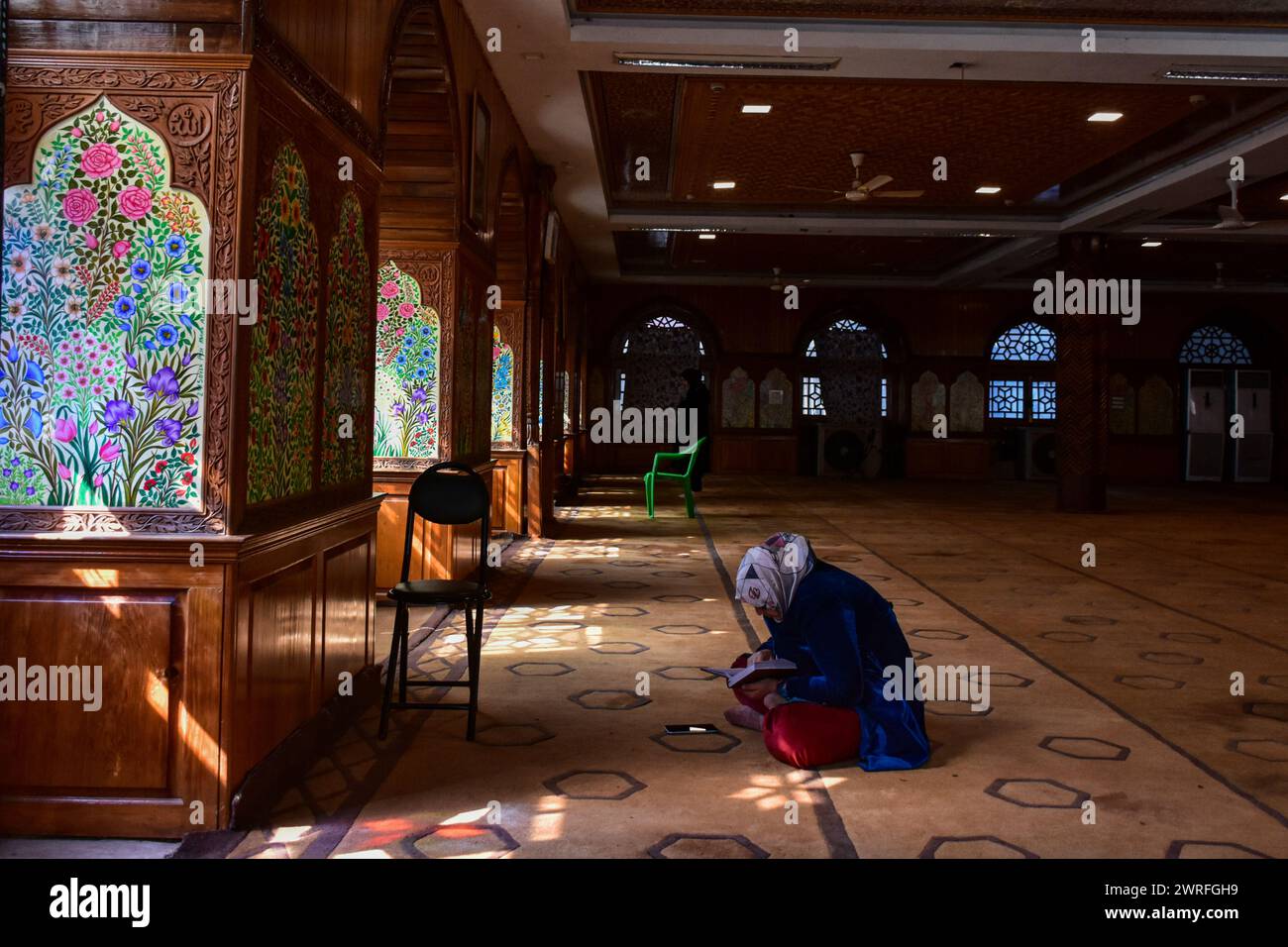 Srinagar, India. 12th Mar, 2024. A Kashmiri Muslim woman prays inside ...