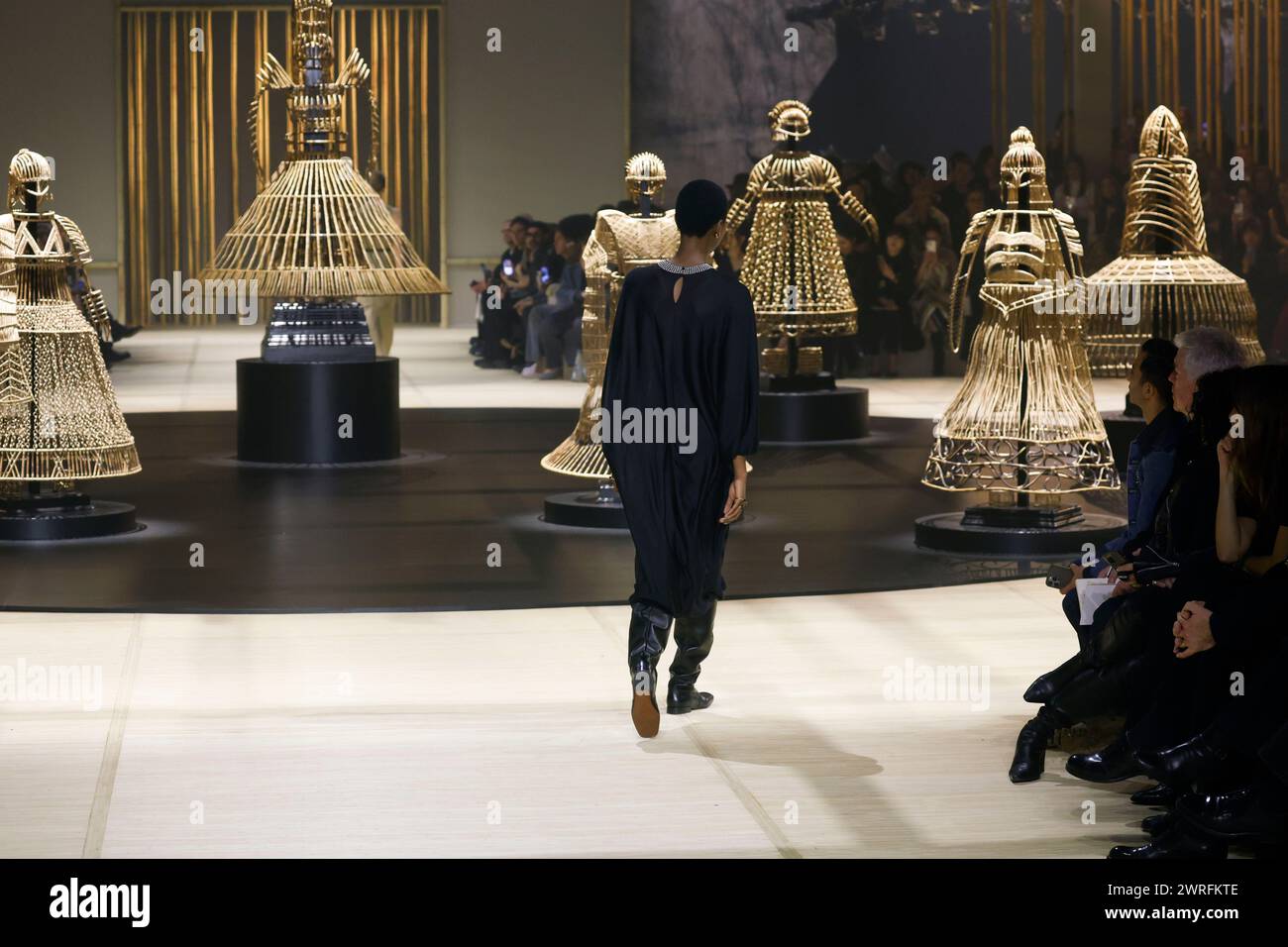 A model walks on the runway at the Dior fashion show during the Fall ...