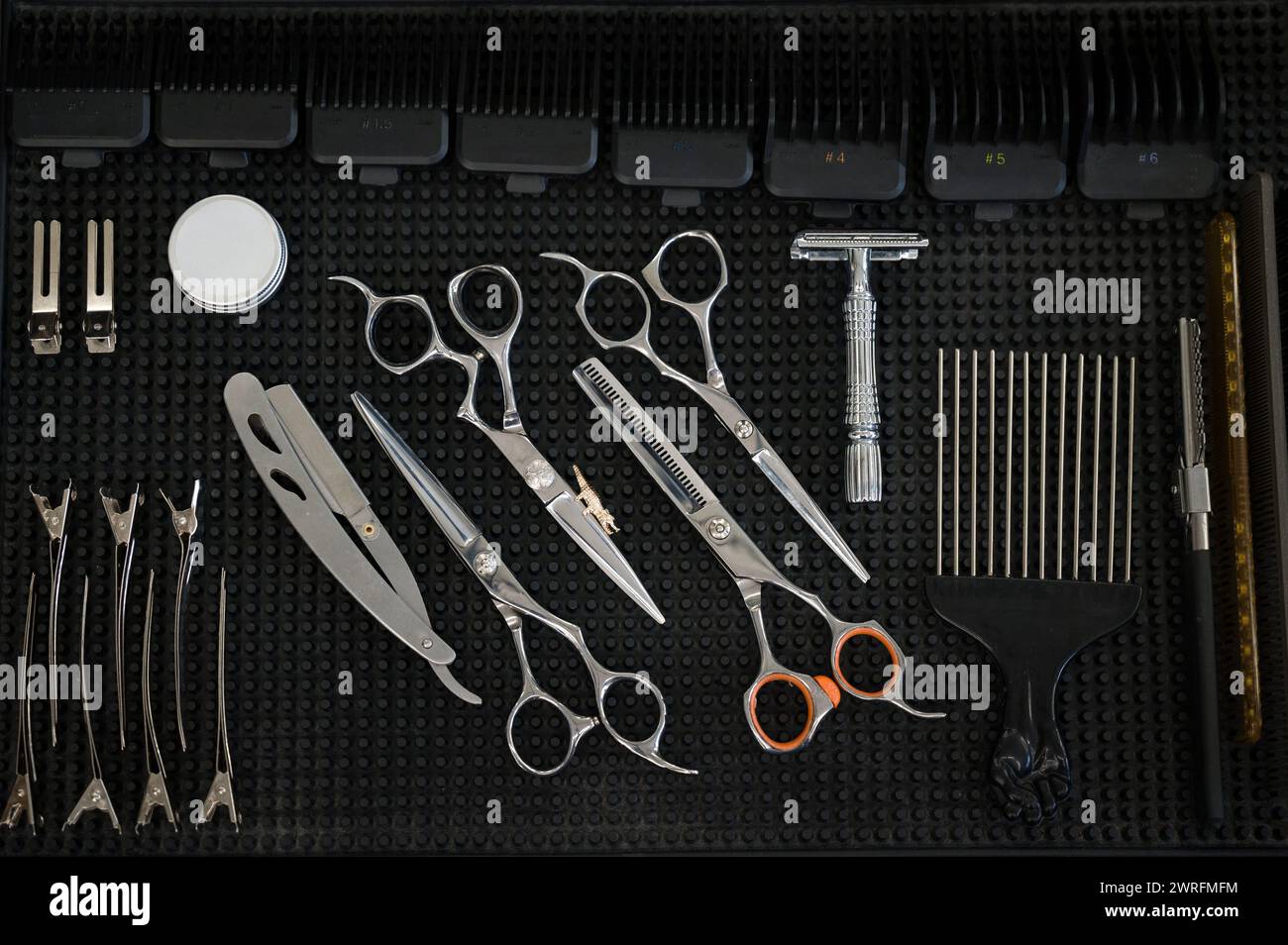 Barbers tools for mens haircuts laid out on a table close up. Set of ...