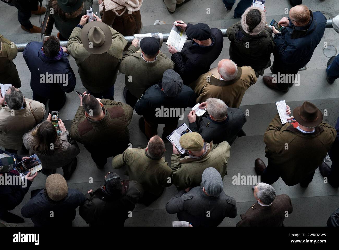 Racegoers in the stands on day one of the 2024 Cheltenham Festival at ...