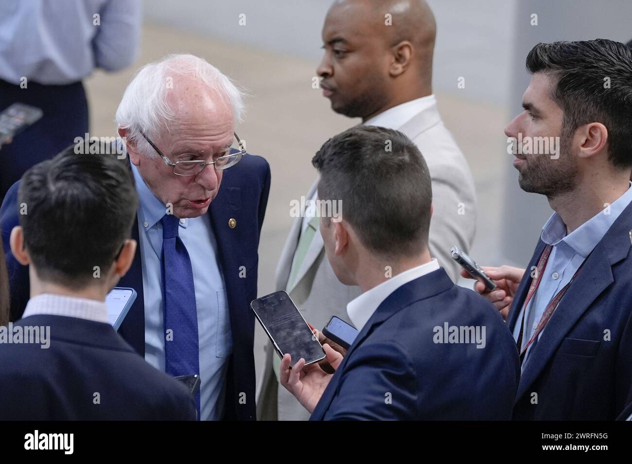 Sen. Bernie Sanders, I-Vt., speaks with reporters at the Senate subway ...