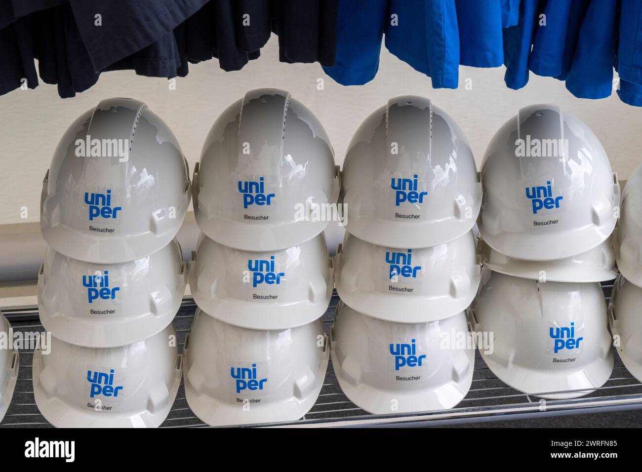 Unterreit, Germany. 12th Mar, 2024. Helmets labeled "Uniper" stand in a cupboard during the ...
