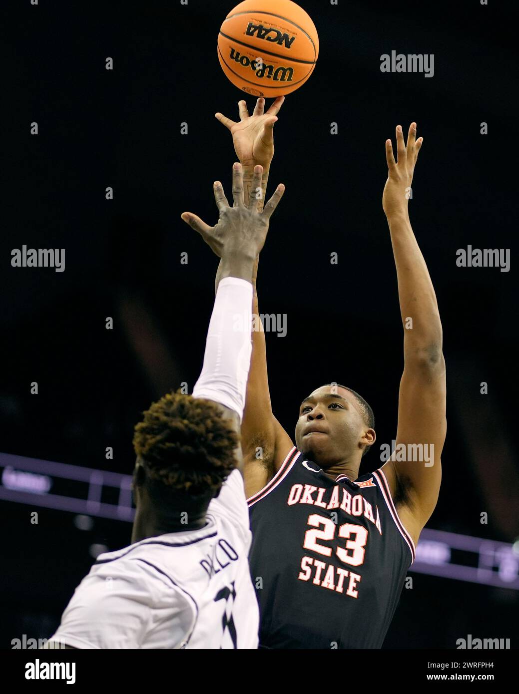 Oklahoma State center Brandon Garrison (23) shoots over UCF forward ...