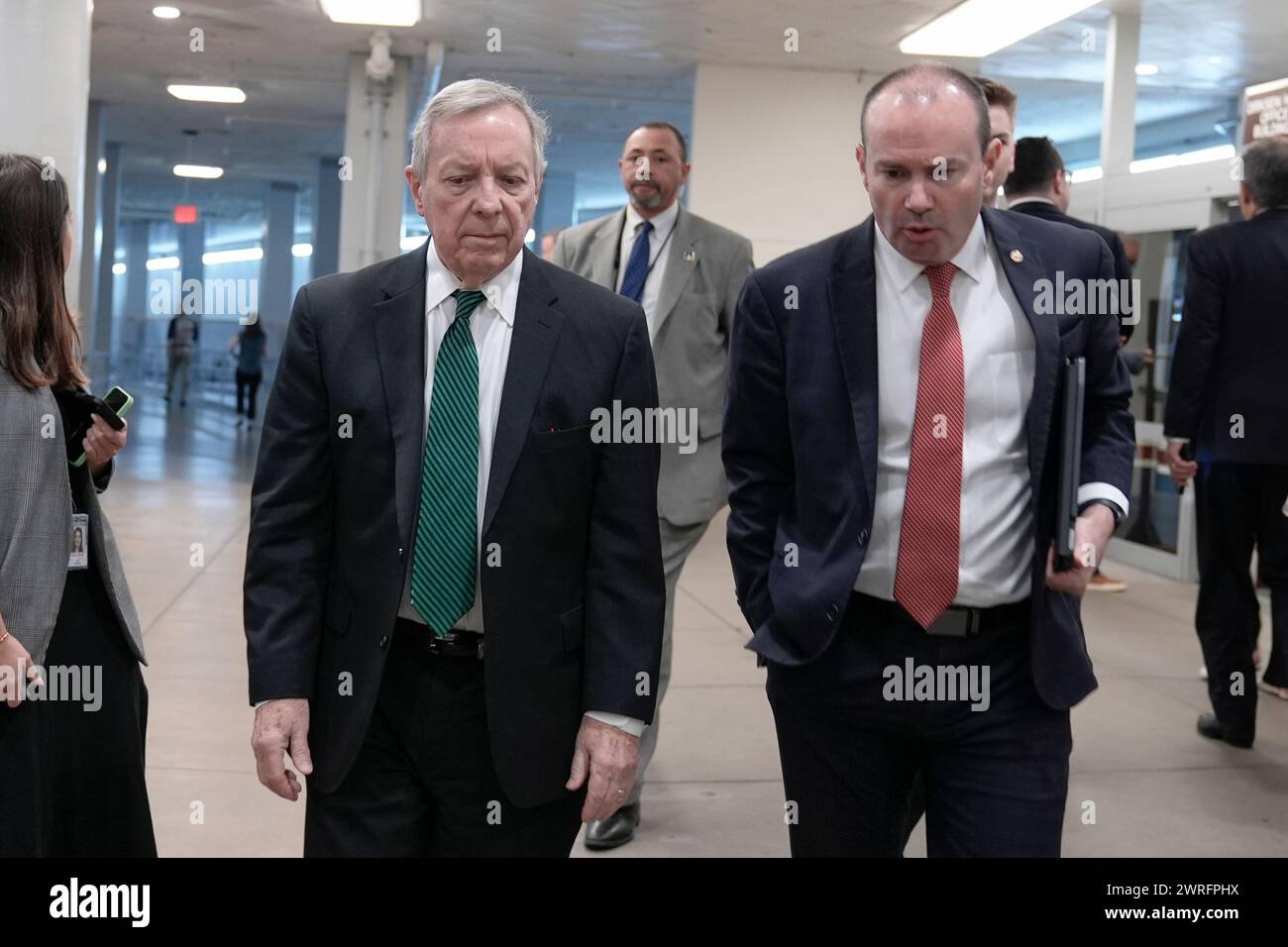 Sen. Mike Lee, R-Utah, right and Sen. Dick Durbin, D-Ill., left, walk ...