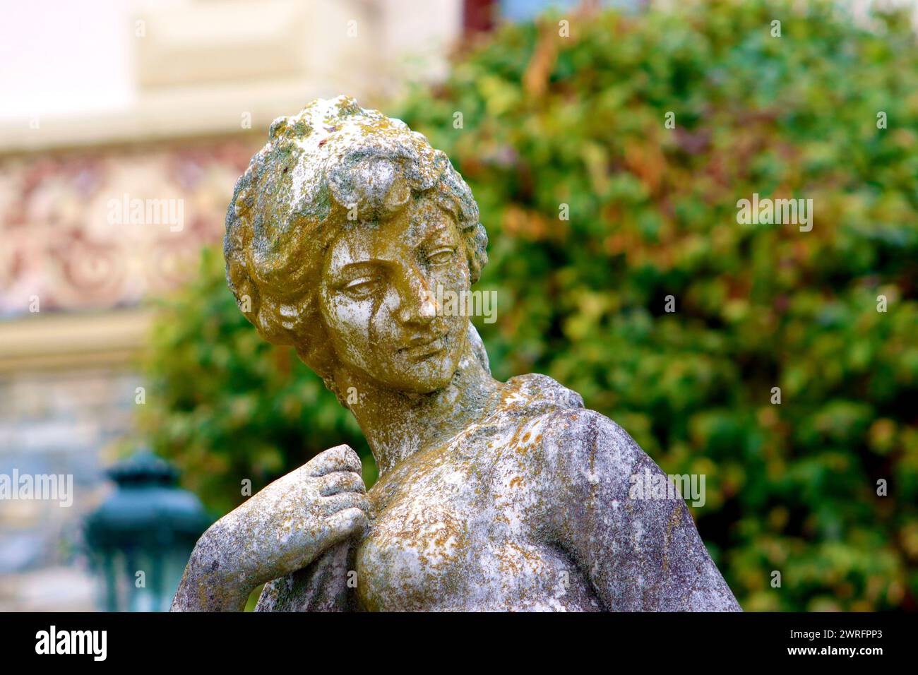 Sinaia, Romania - October 13, 2023: - Female weathered garden statue in the garden of Peles ...