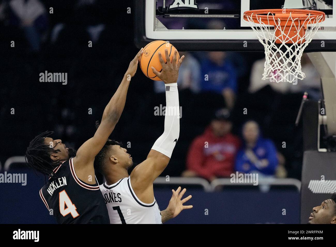 Oklahoma State guard Jarius Hicklen (4) knocks the ball away from UCF ...
