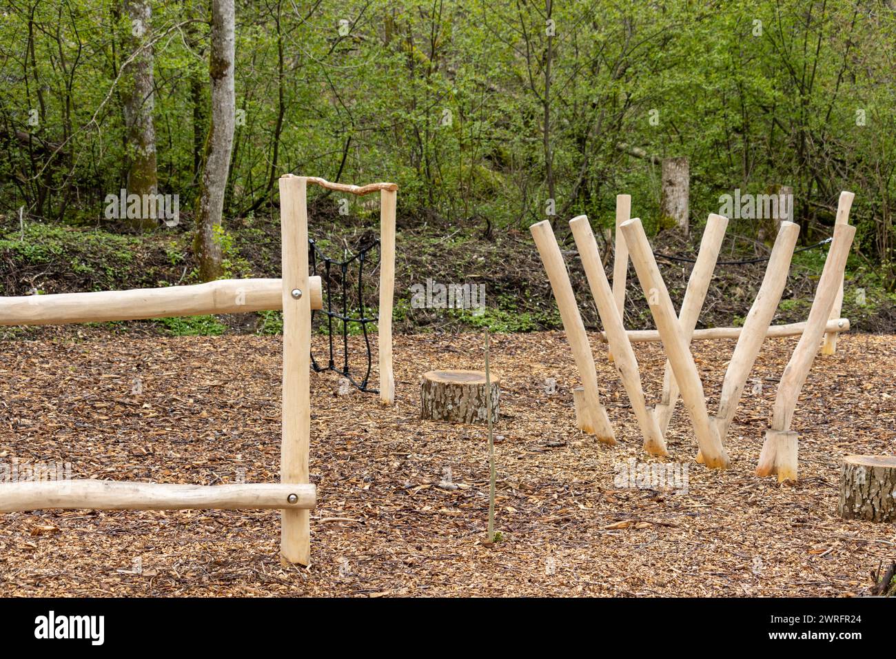 Wooden climbing frame with net in childrens outdoor playground Stock ...