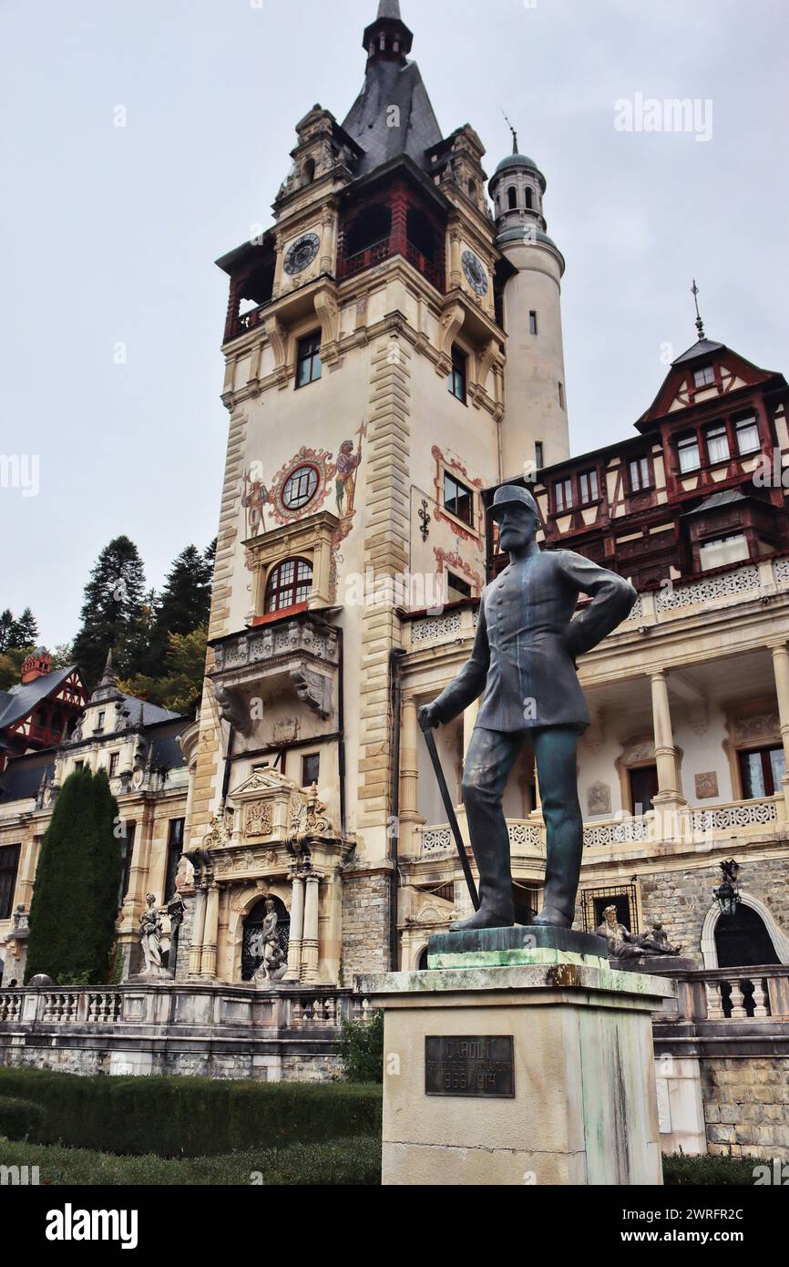 The beautiful Peles Castle, Sinaia, Romania. Statue of king Stock Photo ...