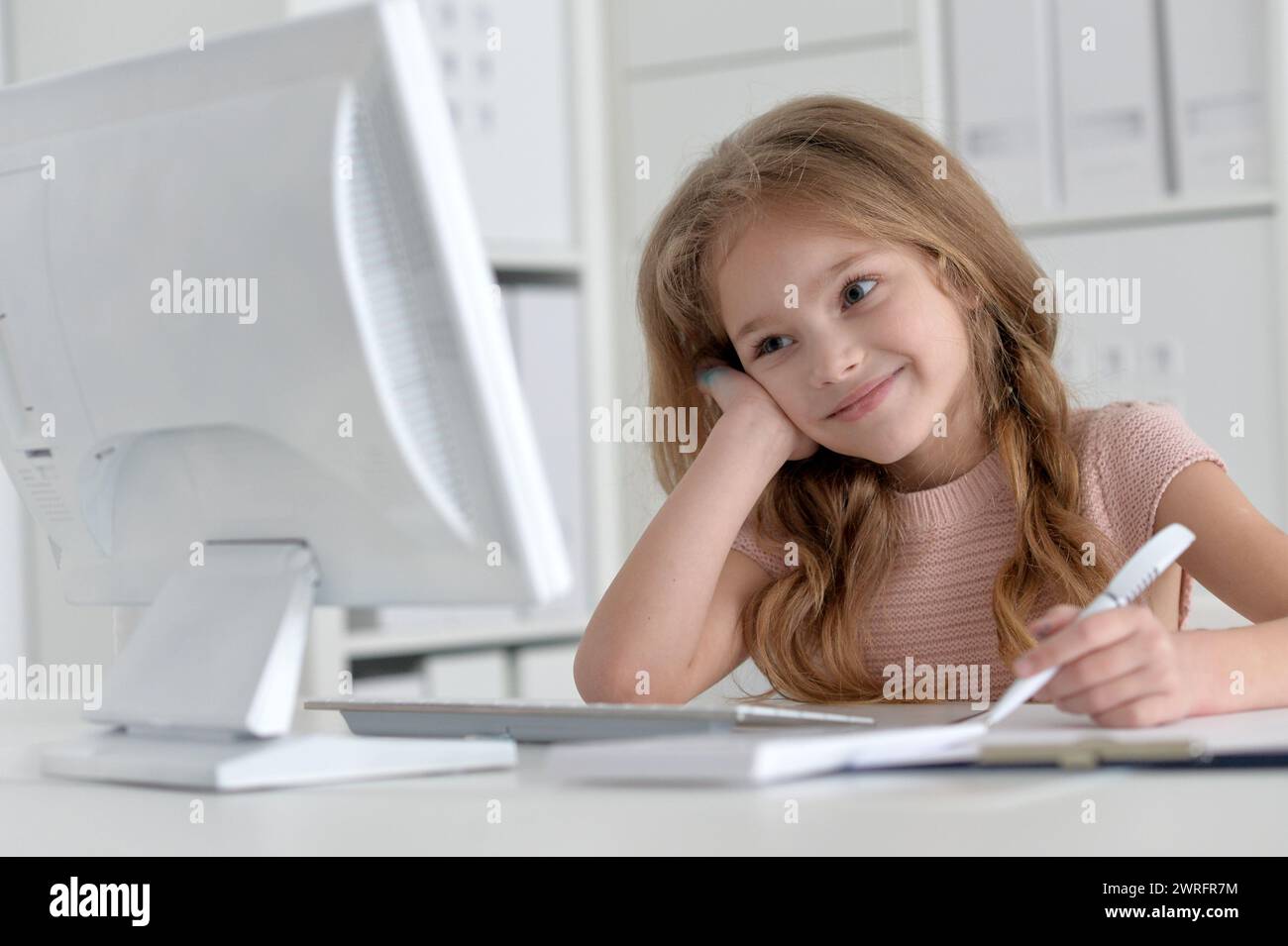 Cute and happy little girl children using laptop computer Stock Photo ...