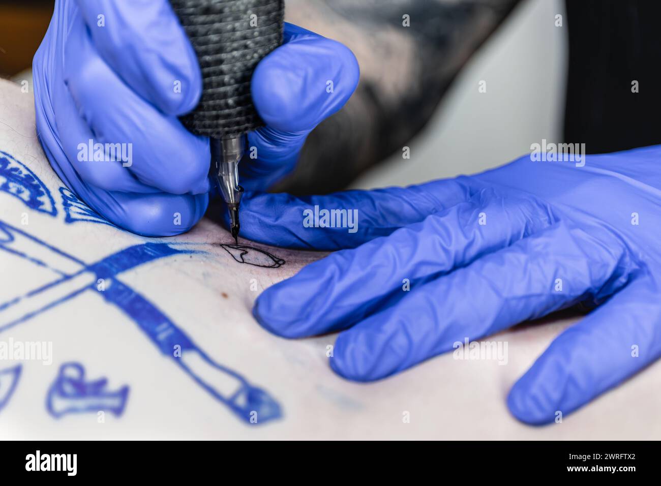 Horizontal photo up-close view capturing the precision of a tattoo ...