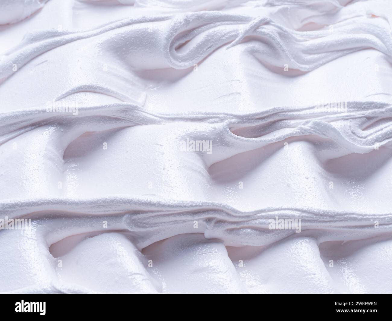 Frozen Lemon flavour gelato - full frame detail. Close up of a white ...
