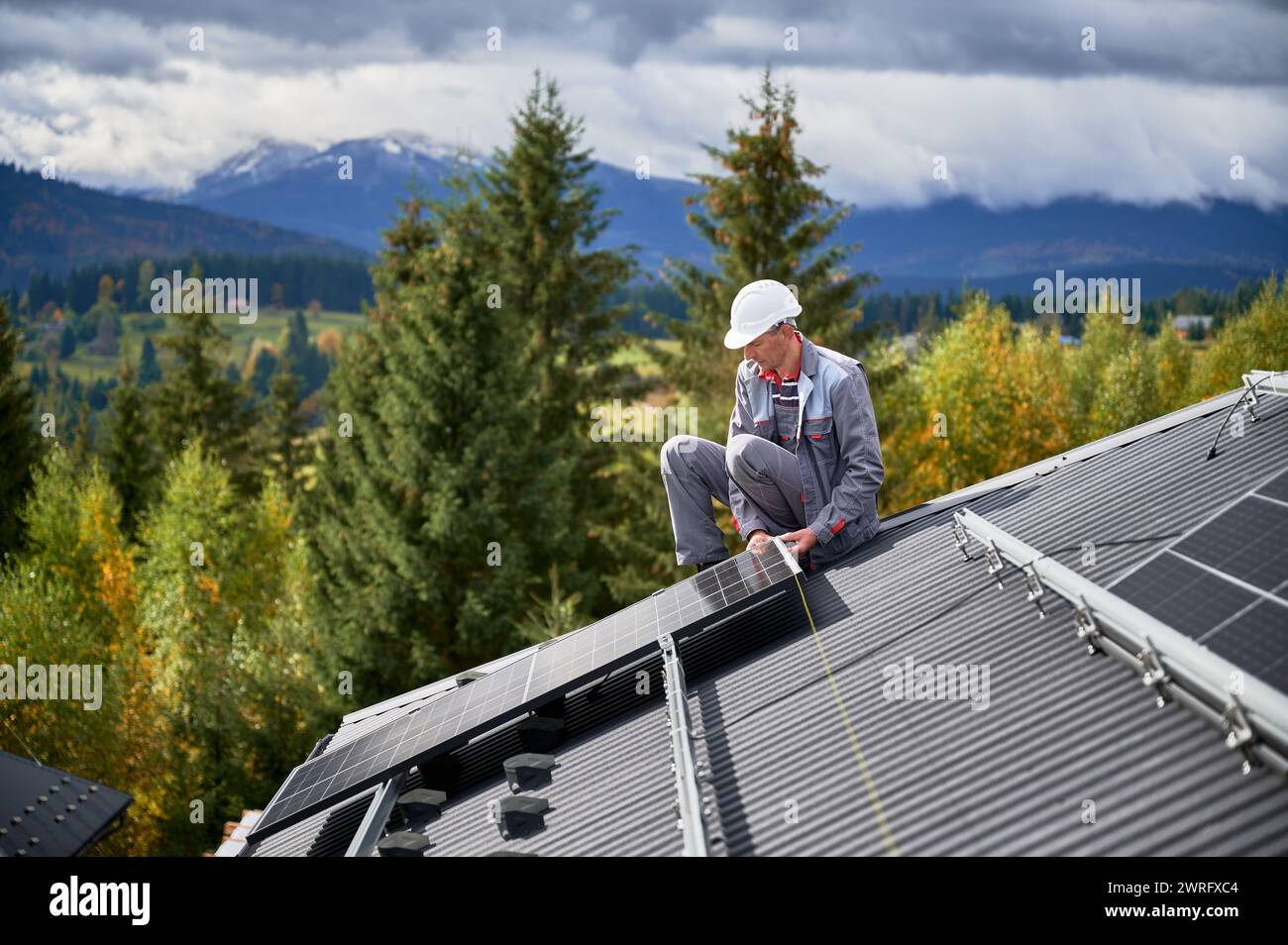 Professional engineer installing solar photovoltaic panel. Worker ...