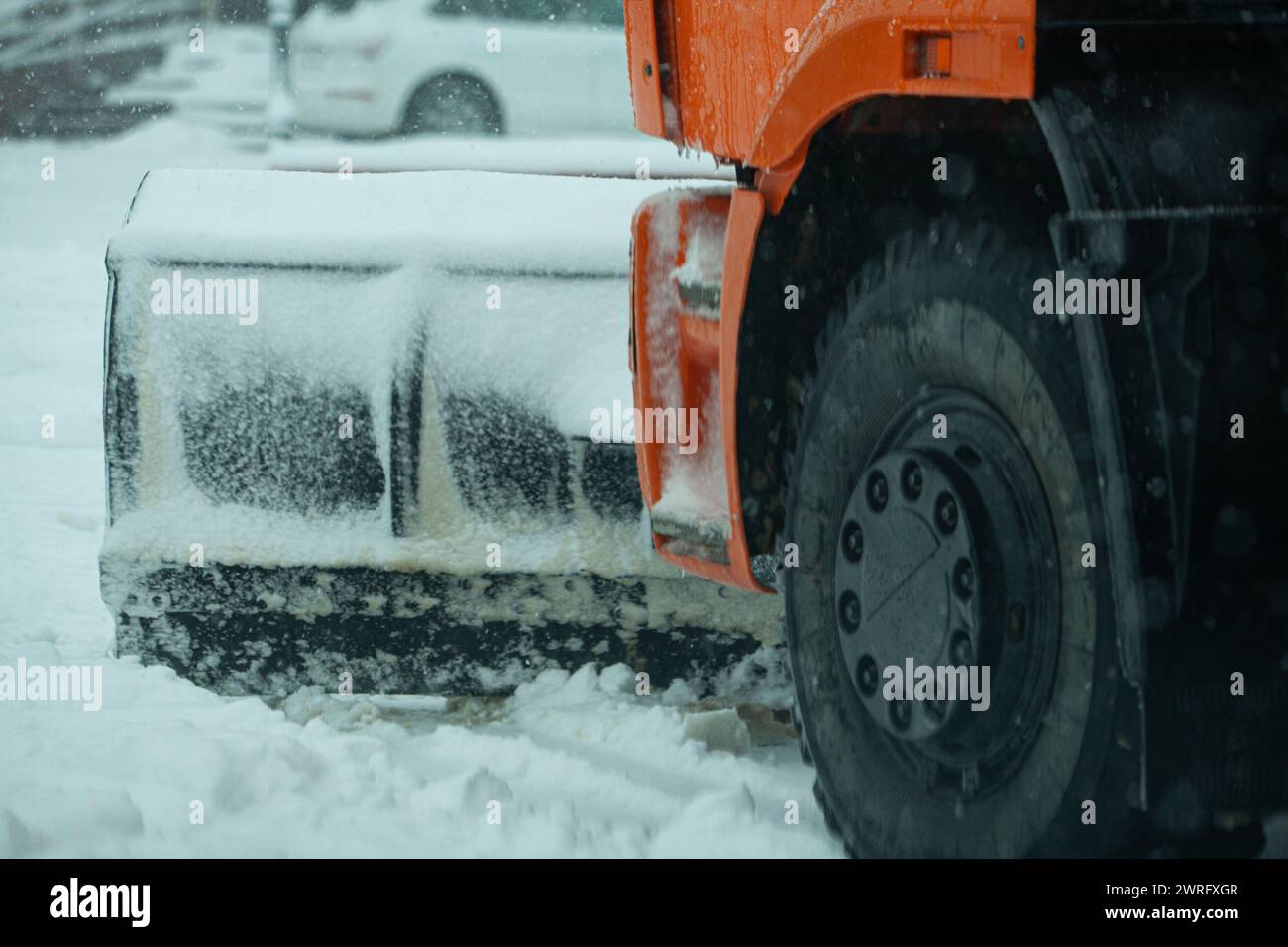 Salt pipeline maintenance. Snowplow on a snowy road in action. Severe ...