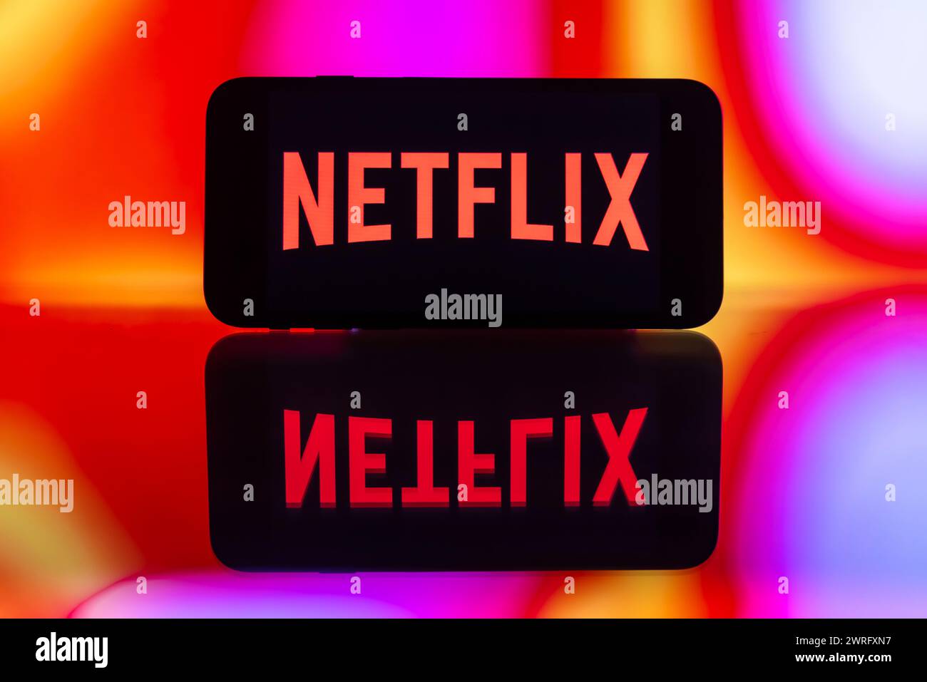 In this photo illustration, the Netflix logo is seen displayed on a ...