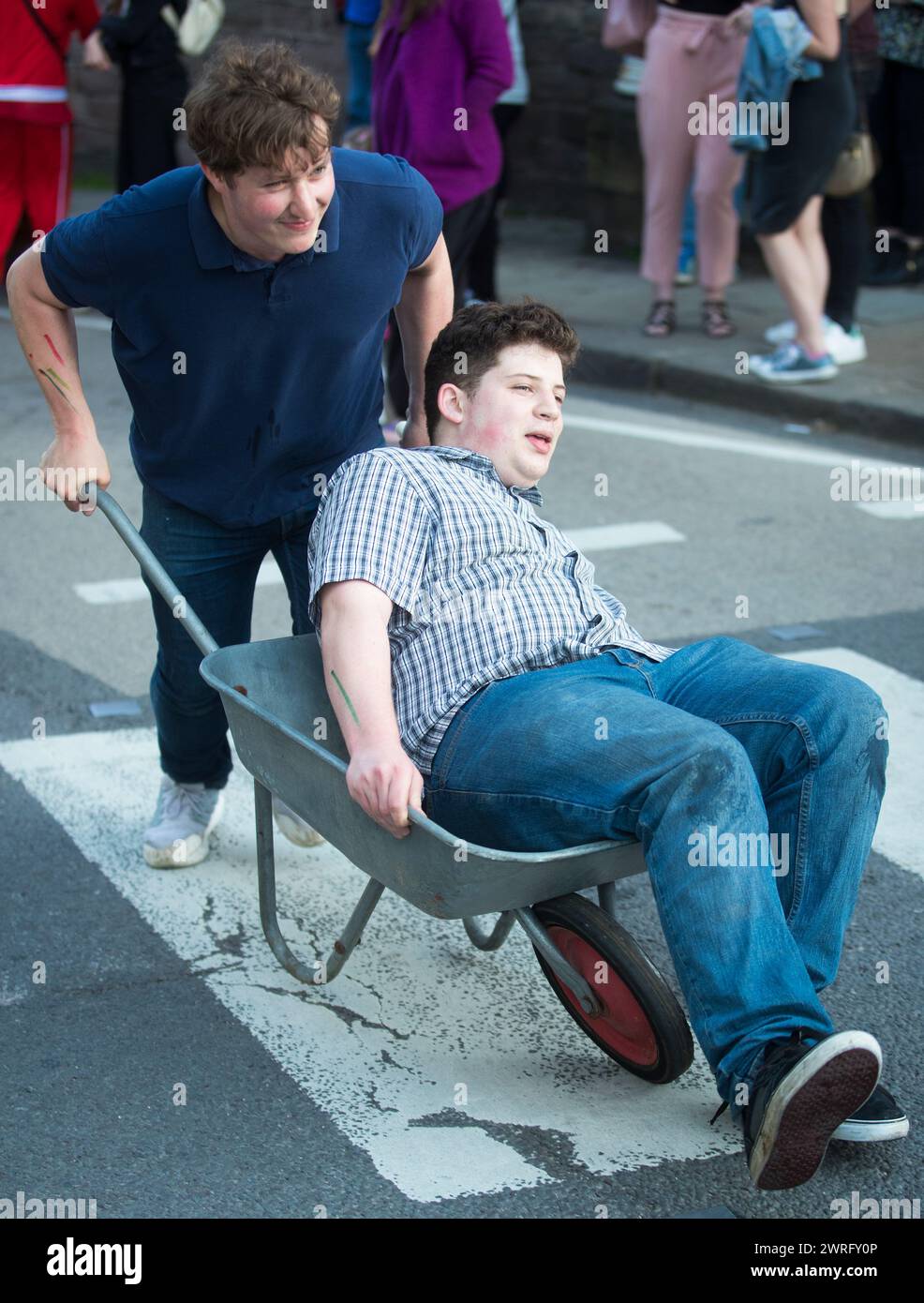 27/05/18 Competitors take part in a vomit-inducing wheelbarrow-race ...