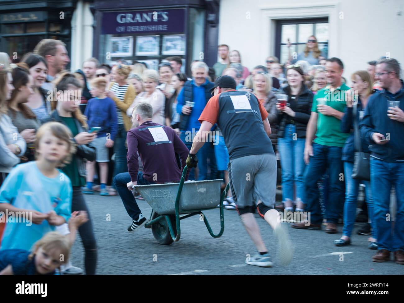 27/05/18 Competitors take part in a vomit-inducing wheelbarrow-race ...