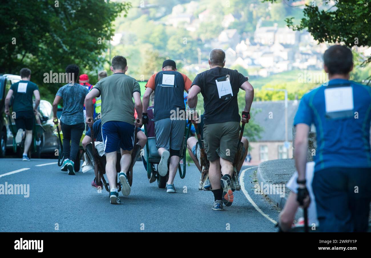 27/05/18 Competitors take part in a vomit-inducing wheelbarrow-race ...