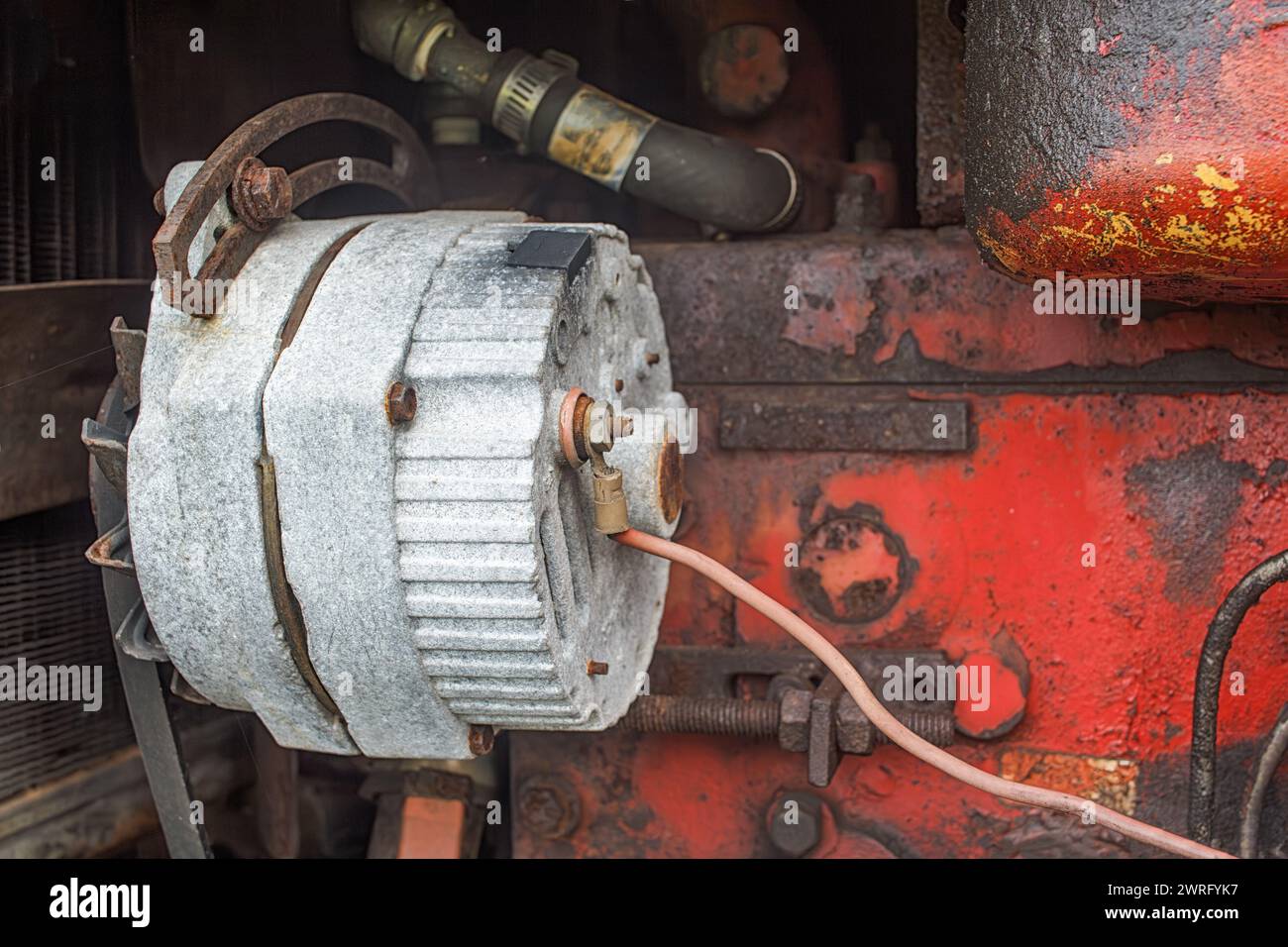 Old farm tractor one wire alternator Stock Photo - Alamy
