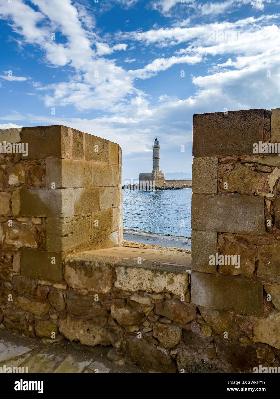 Beacon at Venetian harbour of Chania seen from Firkas fortress. View of ...
