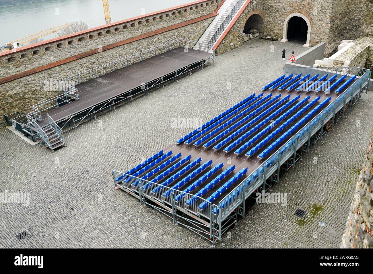 Outdoor concert venue with stage and empty seats rows, mobile metal ...