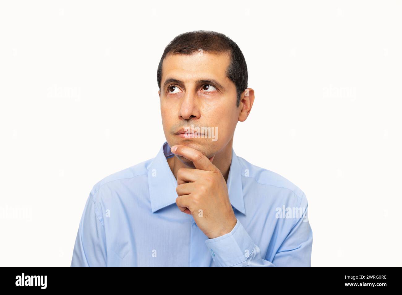 Business man over isolated background with hand on chin thinking about ...