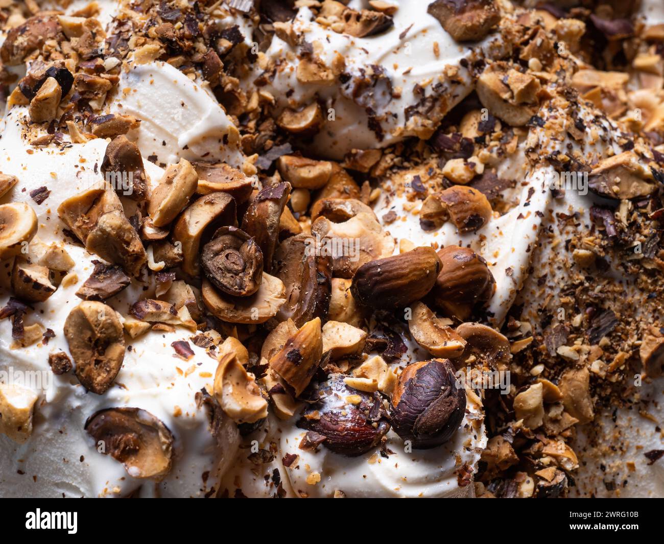 Frozen Hazelnut flavour gelato - full frame detail. Close up of a white ...