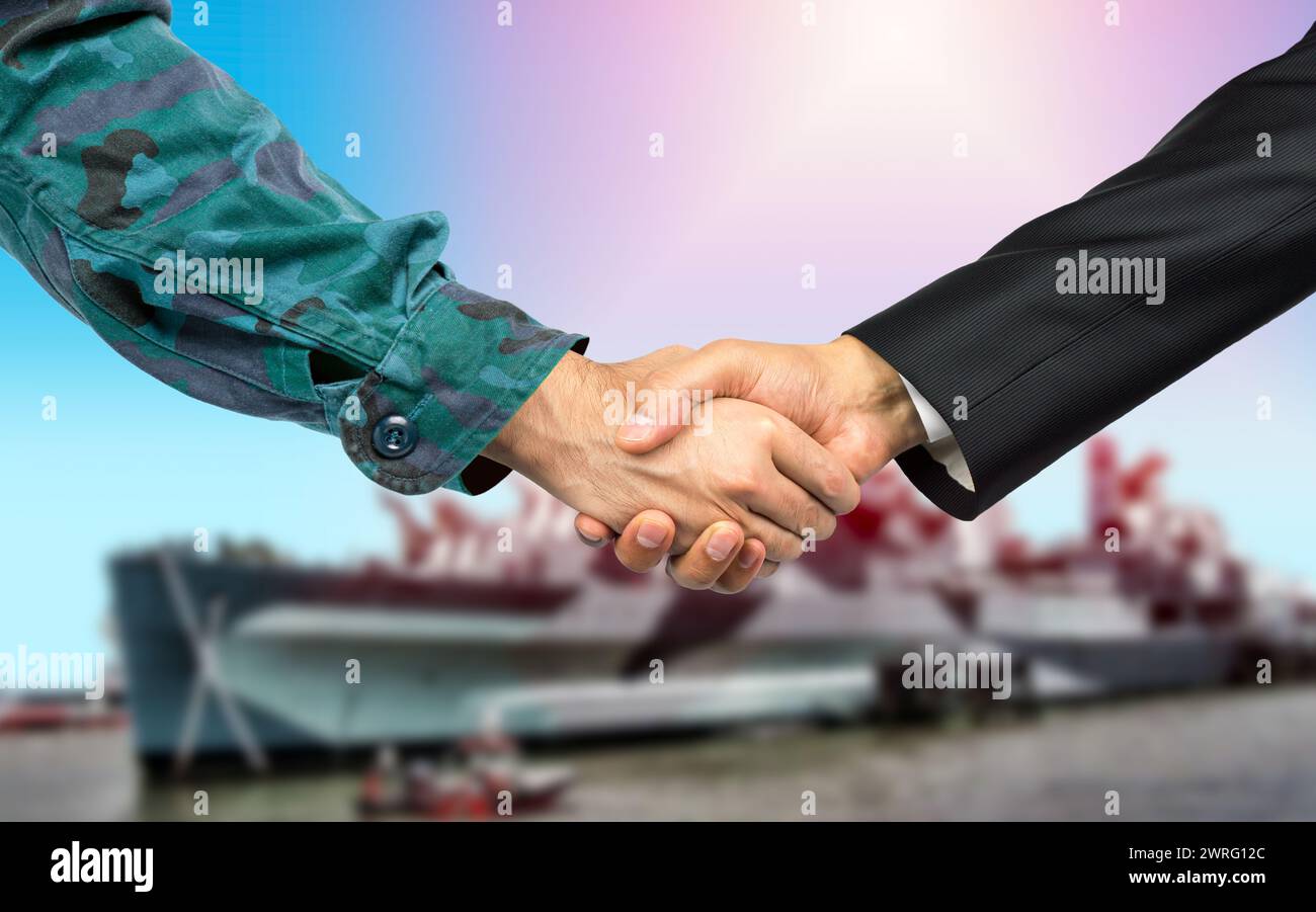 American soldier in uniform and civil man in suit shaking hands with a ...