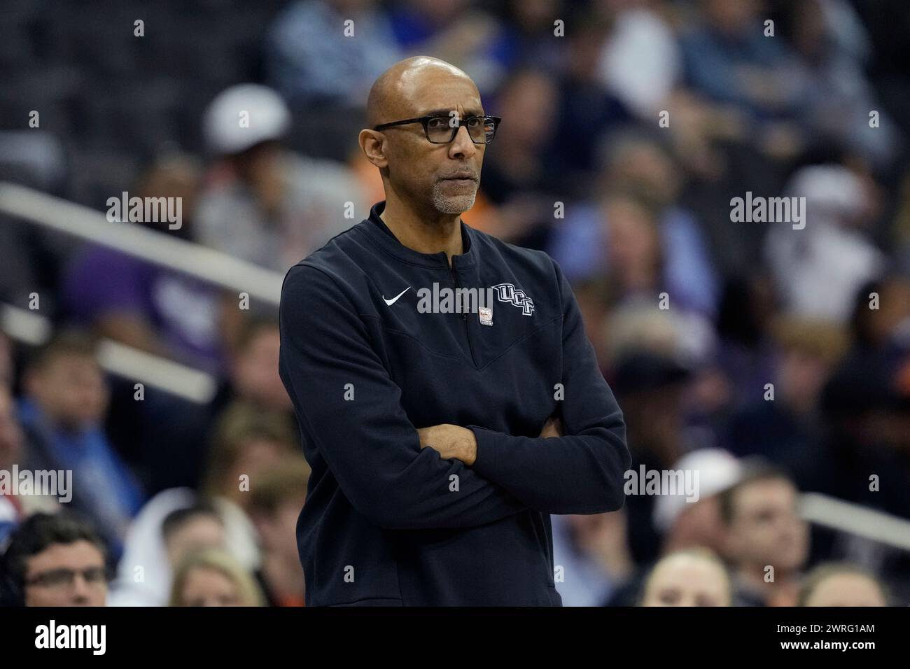 UCF head coach Johnny Dawkins watches during the second half of an NCAA ...