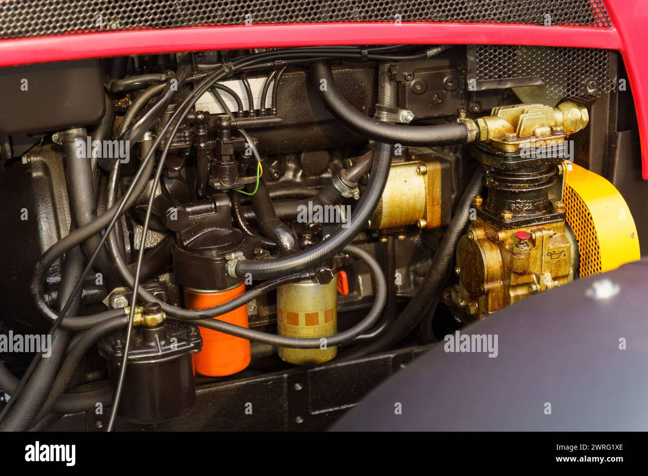 A detailed view of the complex engine components inside a modern ...