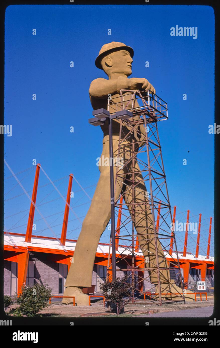 Giant Golden Driller statue. Oil driller and rig. Vintage Americana ...