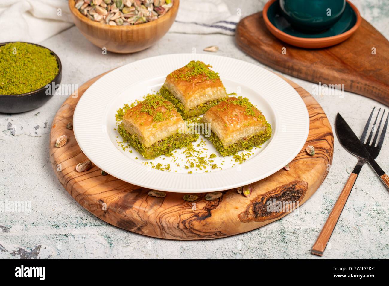 Baklava with pistachios on a wooden background. Turkish cuisine ...