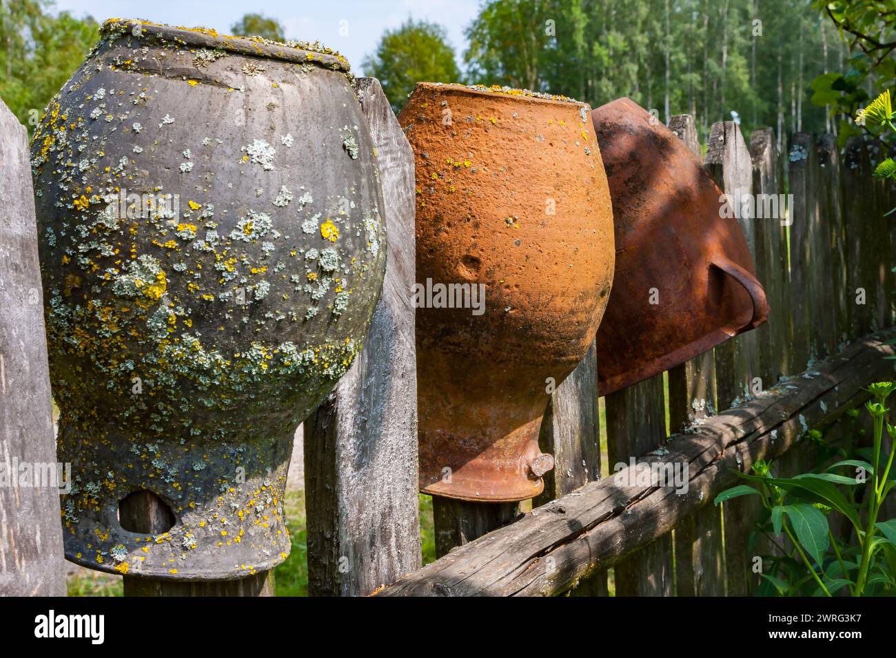 Old jugs hanging on fence hi-res stock photography and images - Alamy