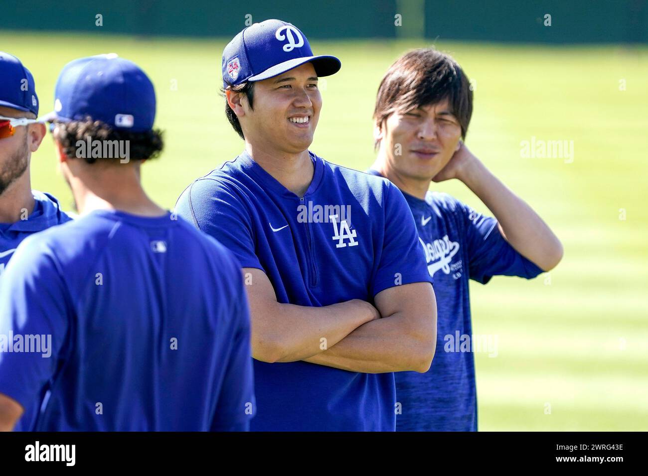 Los Angeles Dodgers Shohei Ohtani, center, participates in spring ...