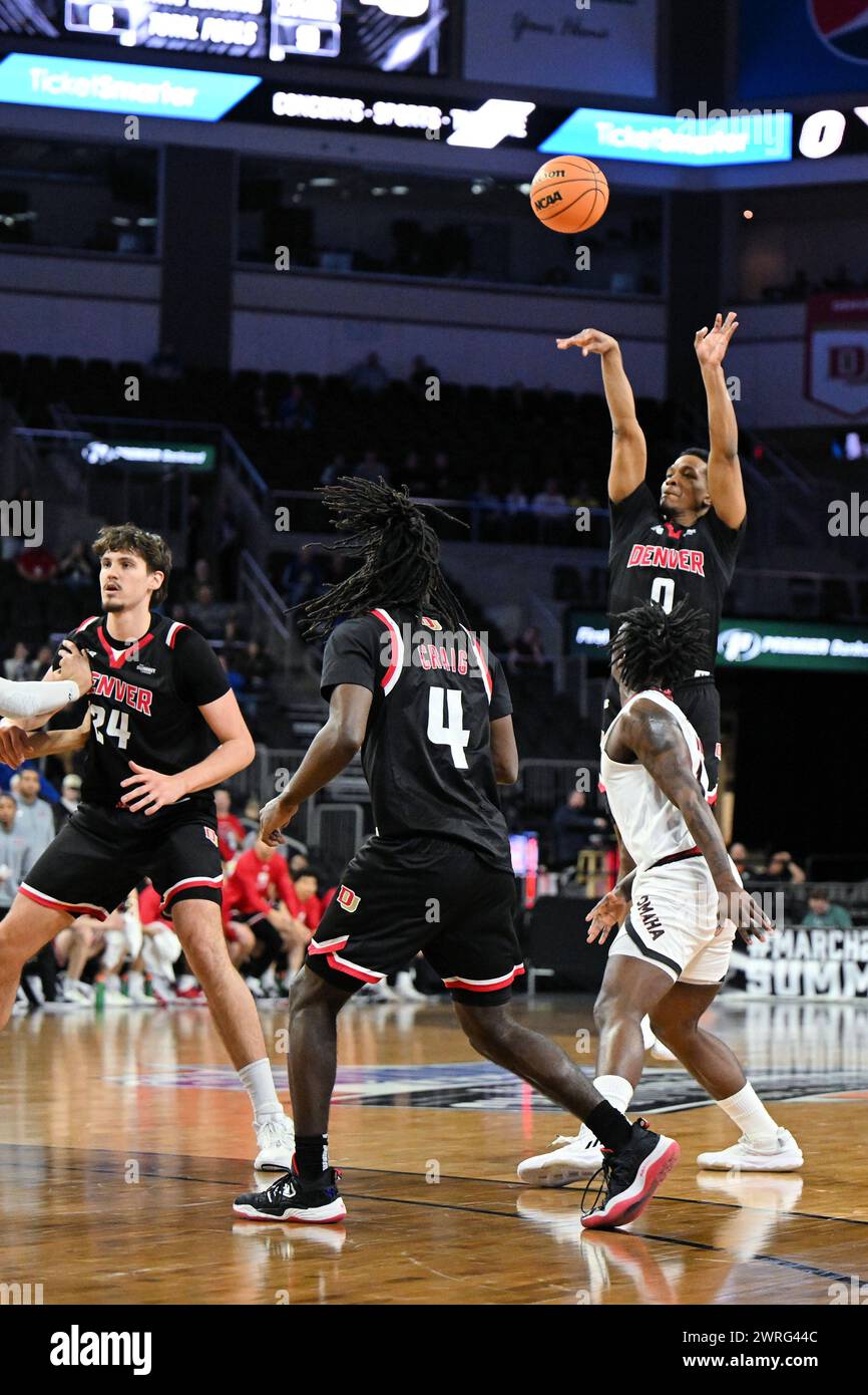 Denver Pioneers guard Tommy Bruner (0) shoots a three pointer during an NCAA men's basketball ...