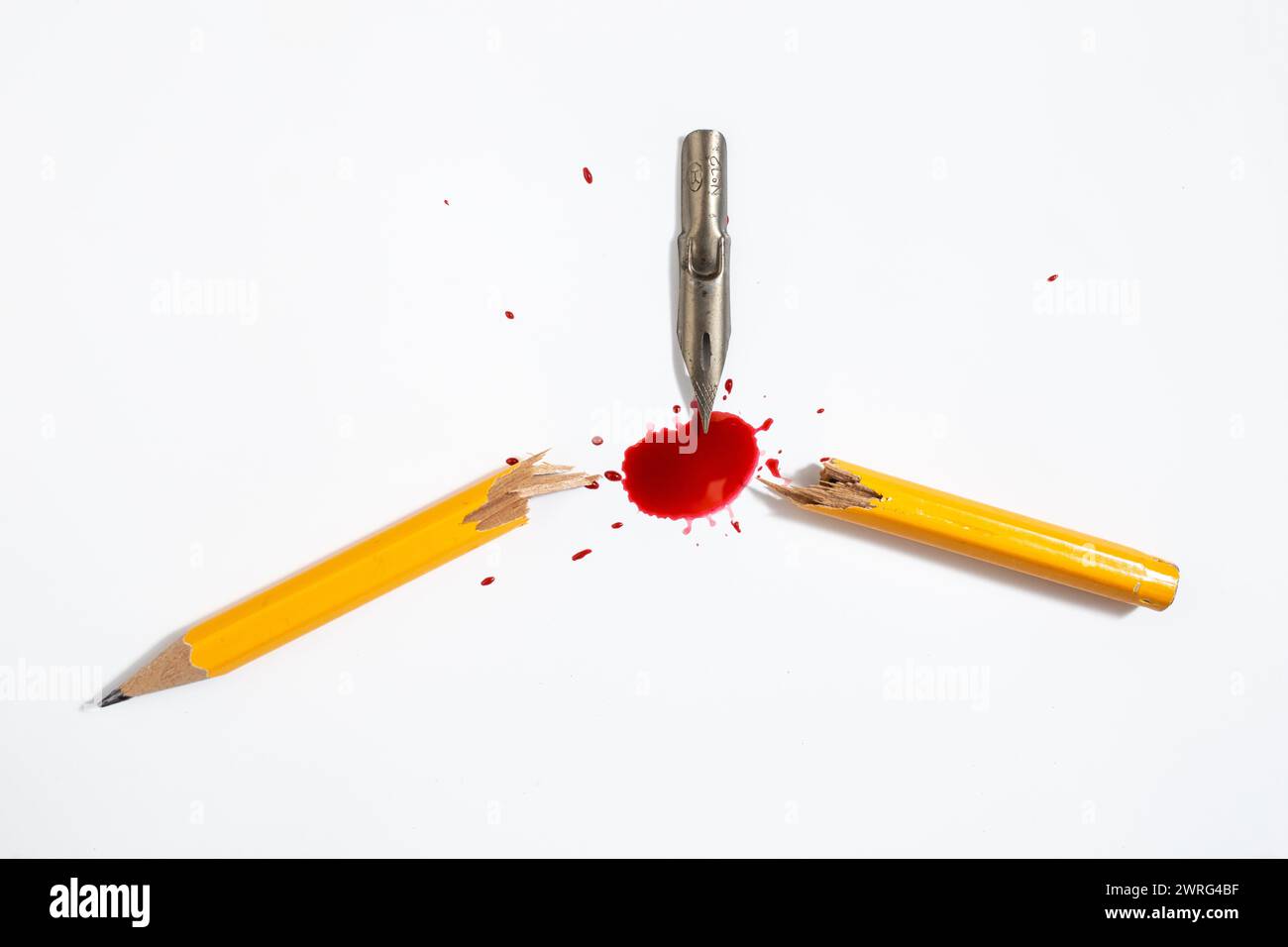 Steel pen nib snapping in half a wooden crayon and staining with blood ...