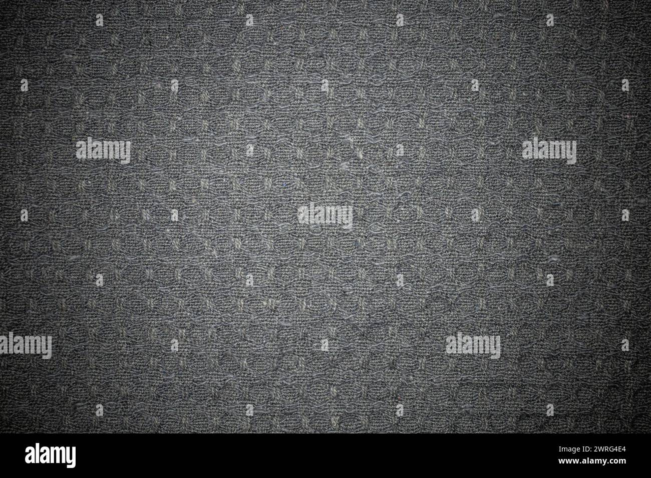 Checkered gray fabric texture with vignette effect, full frame close up ...