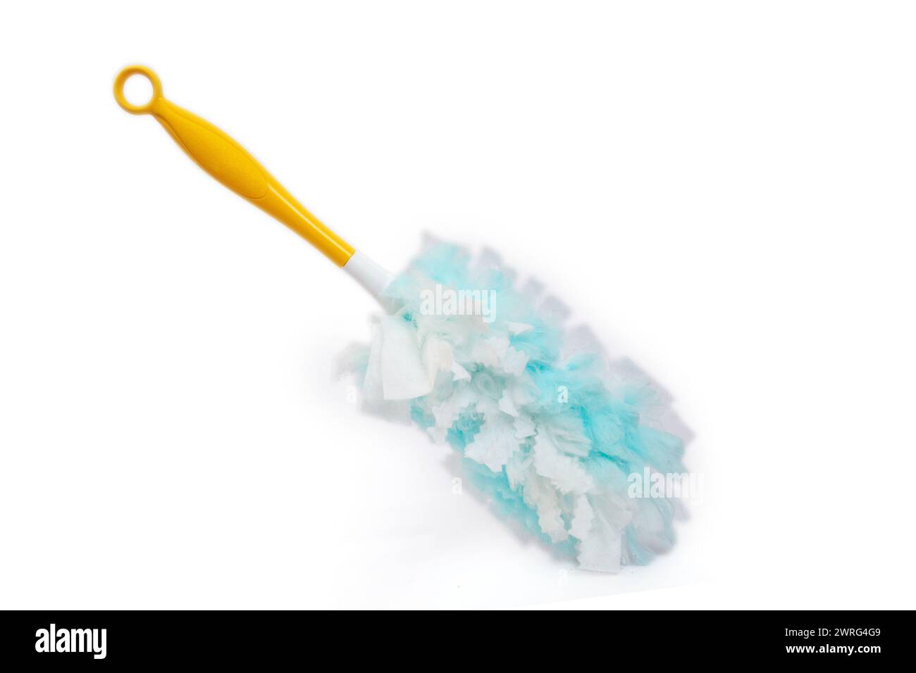 Artificial fiber duster with plastic yellow handle isolated on white ...