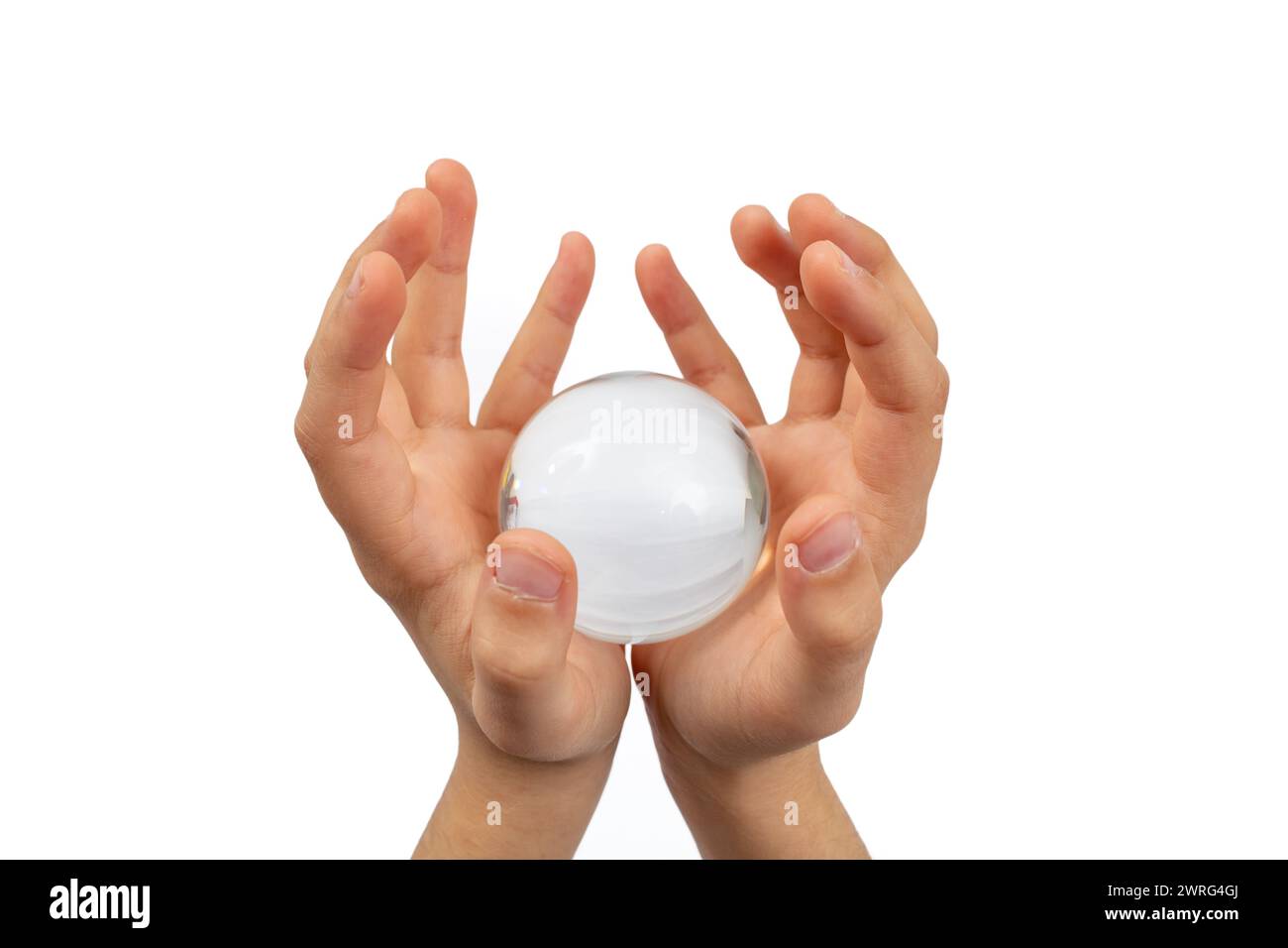 Child hands holding a glass sphere isolated on white background ...