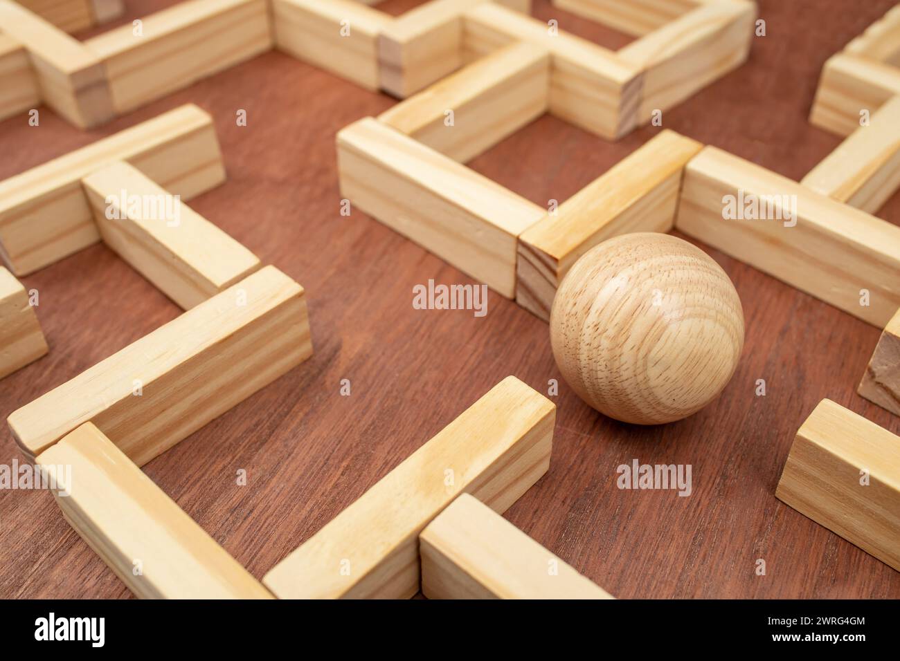 Wooden maze made with wood blocks and a wood sphere, finding labyrinth ...