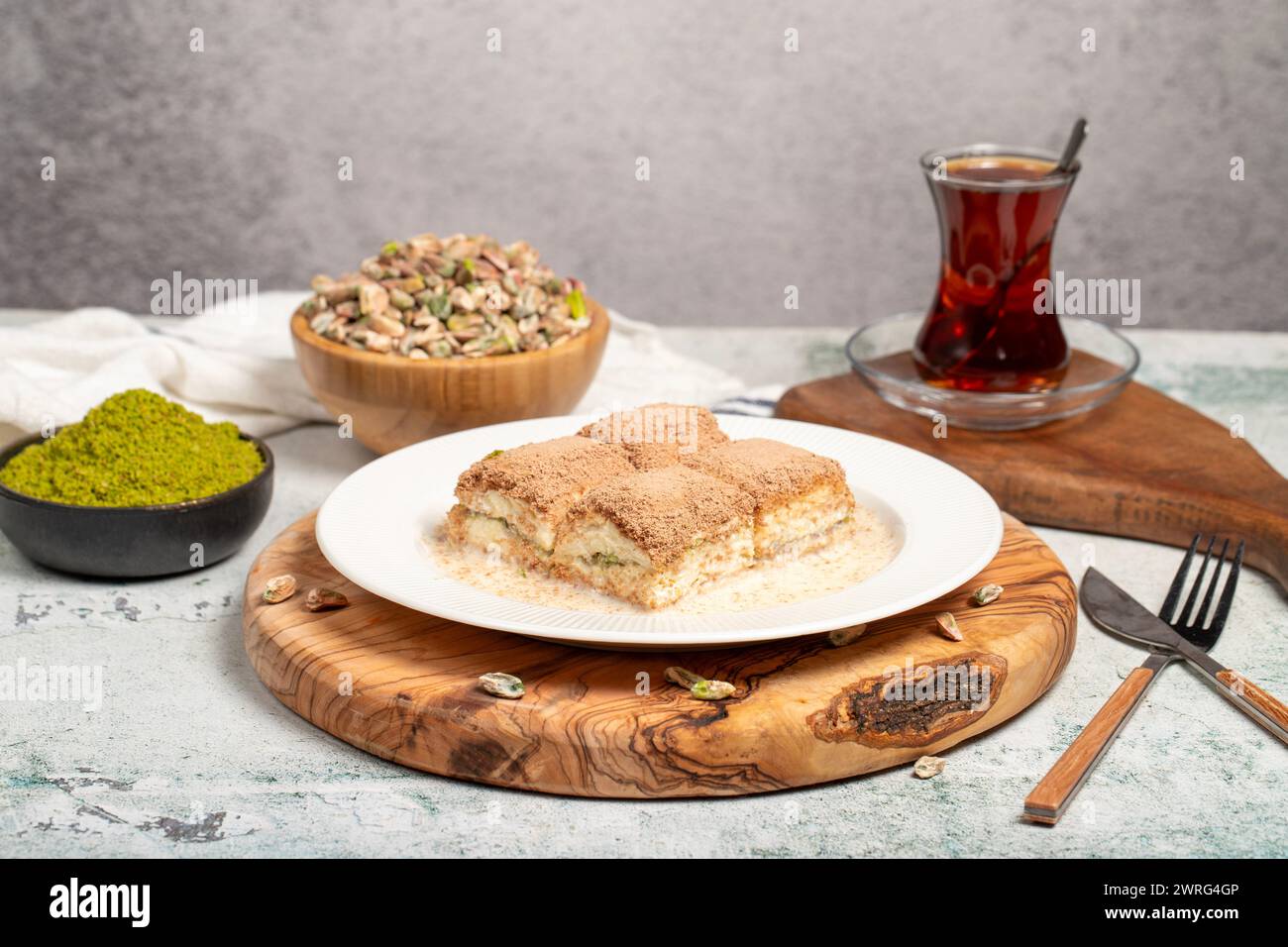 Cold baklava with pistachios on a wooden background. Turkish cuisine ...