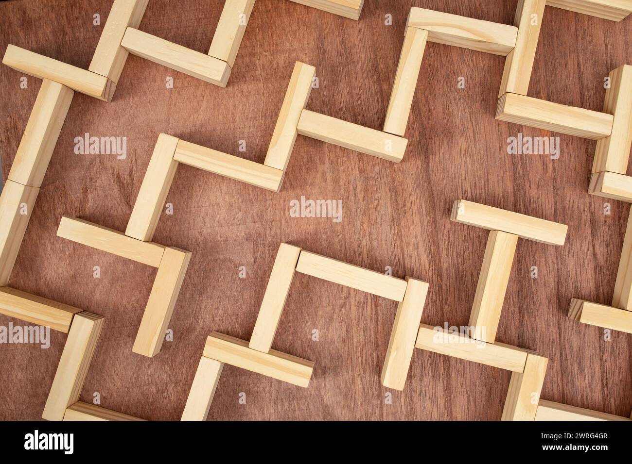 Top view of a wooden labyrinth, empty maze backdrop, soft focus close ...