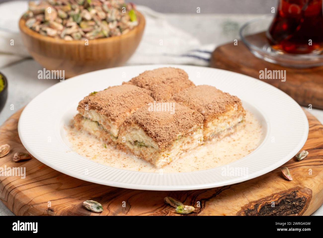 Cold baklava with pistachios on a wooden background. Turkish cuisine ...