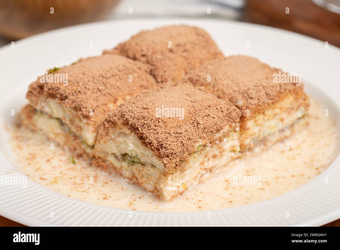 Cold baklava with pistachios on a wooden background. Turkish cuisine ...
