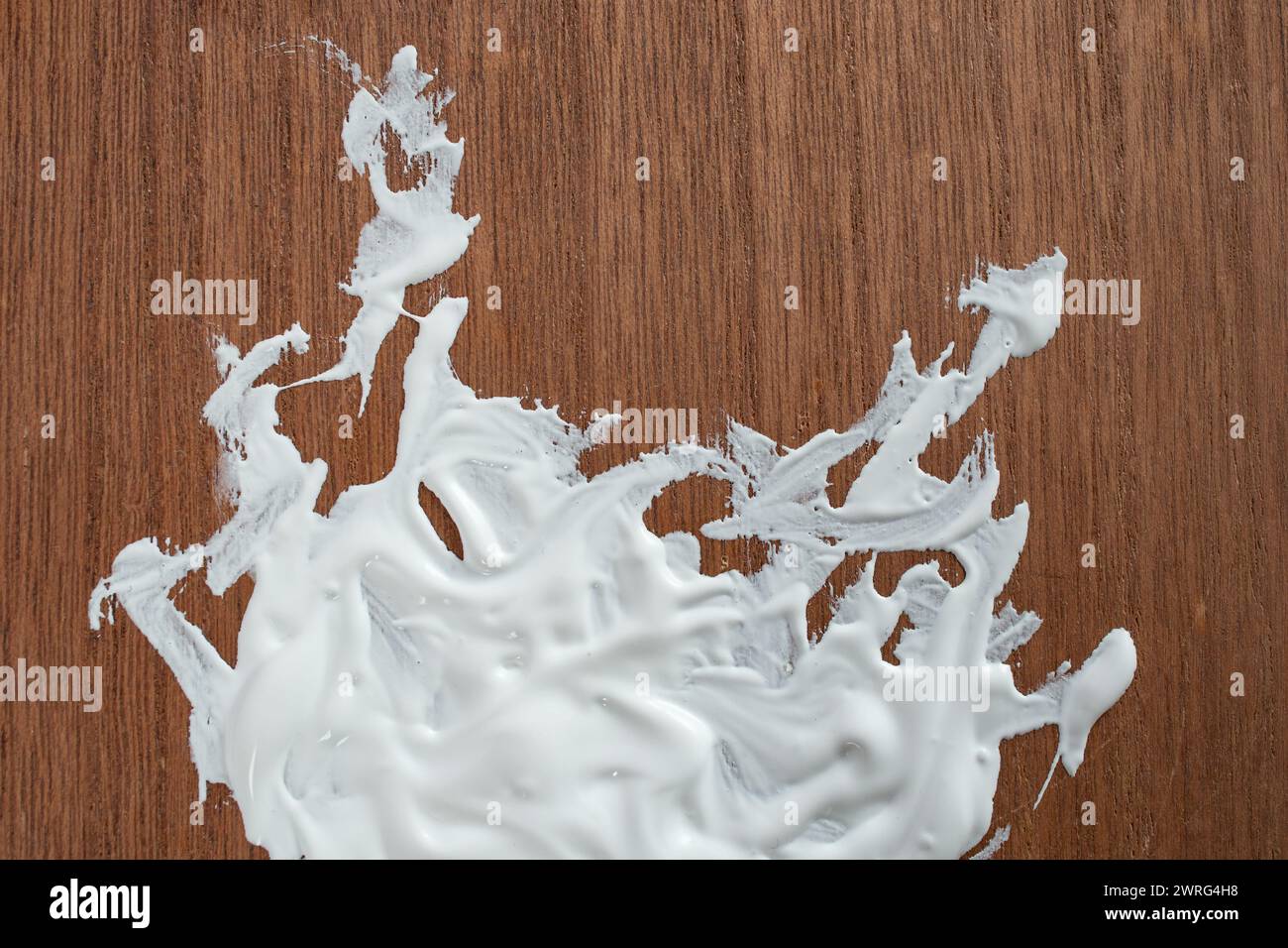 Wet white paint smudge on dark brown hard wood texture Stock Photo - Alamy